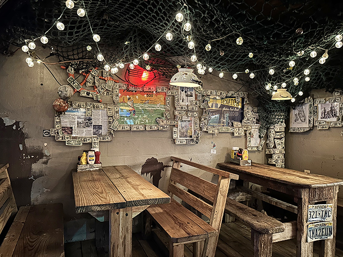 Fishing nets overhead, string lights twinkling, and wooden benches worn smooth by decades of happy diners. Ambiance you simply can't manufacture.