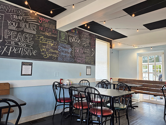 String lights and inspirational chalkboard wisdom create the perfect backdrop for conversations that flow as easily as the coffee refills.