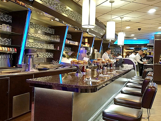 The counter where diner magic happens, where coffee cups are never empty and friendly conversation flows as freely as the refills.