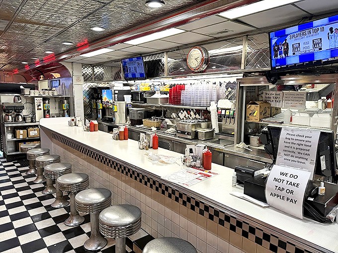 Where culinary magic happens in plain sight. The counter seats are prime real estate for solo diners and curious food-watchers.