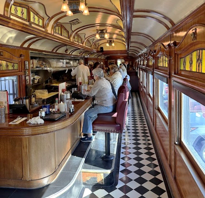 Counter seating offers front-row tickets to the culinary show, where fellow diners become temporary neighbors in this wood-paneled community.