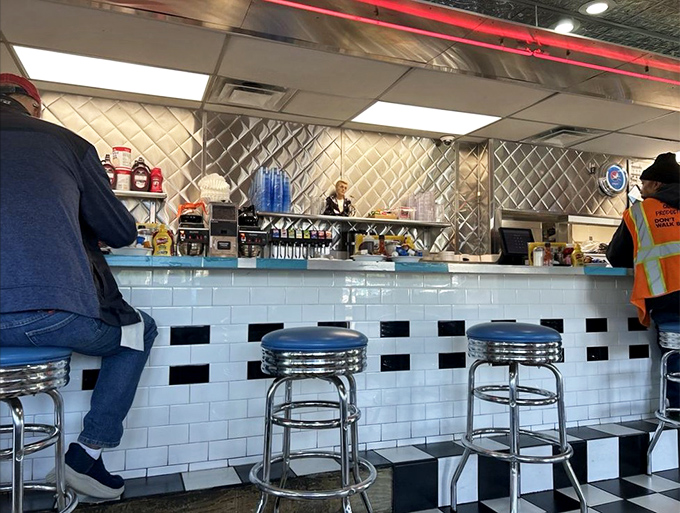 The counter seating offers front-row seats to the breakfast ballet happening on the griddle behind.