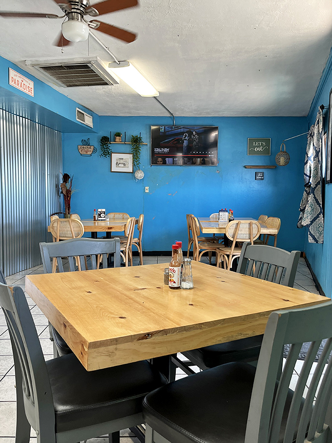 Simple wooden tables and blue walls create a homey atmosphere where the food, not the decor, rightfully takes center stage.
