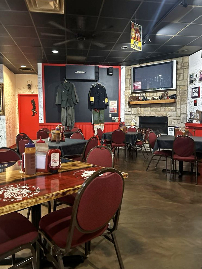 Red chairs await hungry patrons while military uniforms stand guard. This dining room honors service while serving up some of Kentucky's finest.