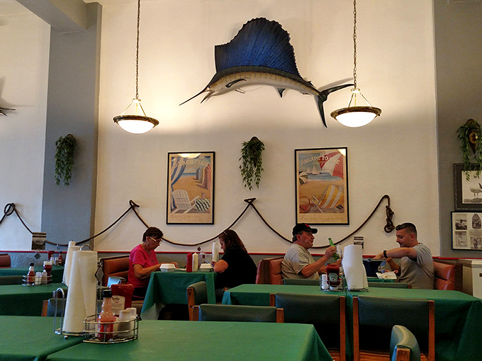 A magnificent sailfish presides over diners like Neptune watching his subjects. The nautical touches remind you of exactly where your meal originated.