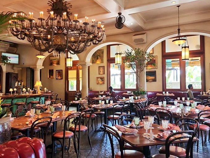 Grand chandeliers, arched doorways, and colorful table settings create dining room drama without an ounce of stuffiness or pretension.