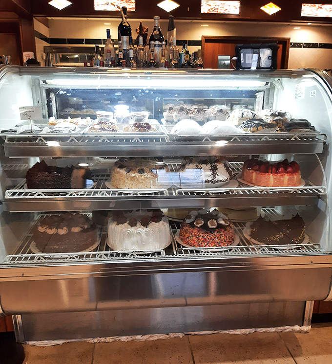 The dessert case &ndash; a glass-enclosed museum of temptation showcasing cakes and pies that make willpower seem like a completely overrated virtue.