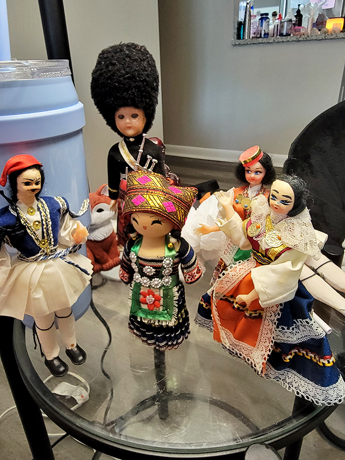 International dolls with traditional costumes create a miniature United Nations of collectibles. Each tiny face represents craftsmanship and cultural heritage.