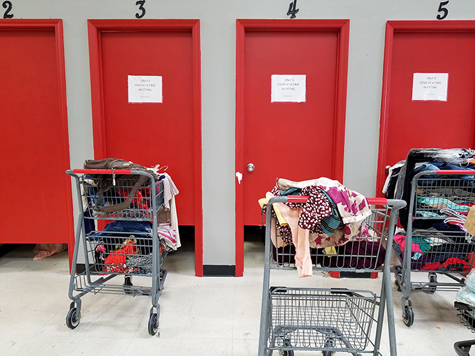 The fitting room area&mdash;where thrift store dreams either come true or die. Those carts hold the hopes, aspirations, and occasional reality checks of bargain seekers.
