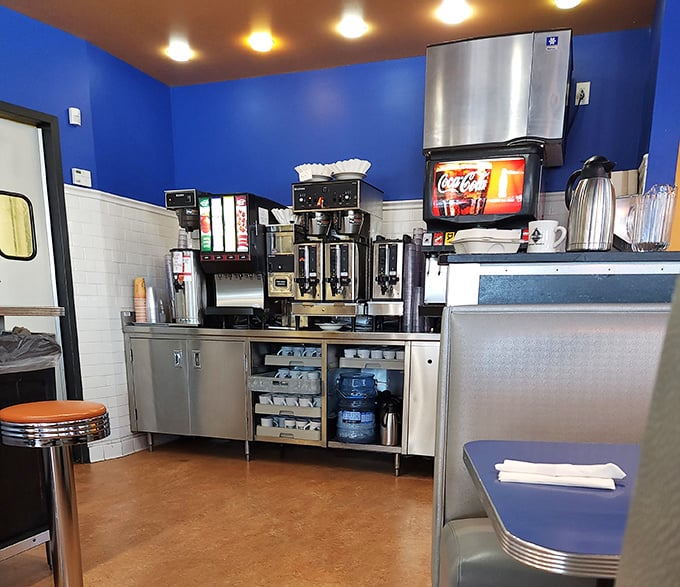 The coffee station—sacred ground where the elixir of life flows freely, fueling conversations and curing what ailed you from the night before.