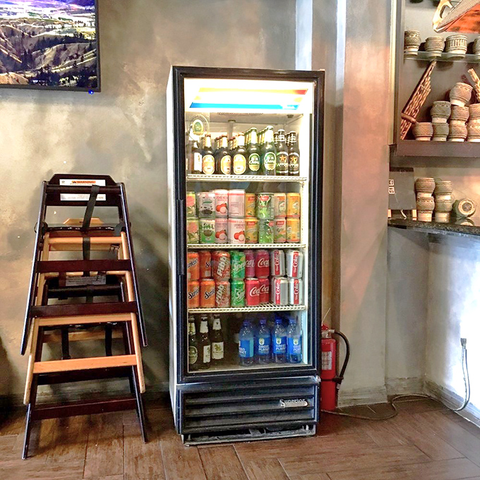 The drink cooler stands ready with refreshing options to tame the heat from those chili-spiked Laotian specialties.