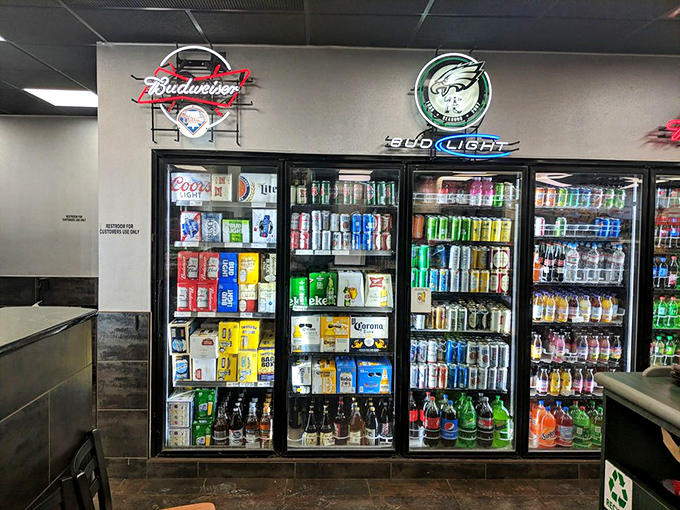 Philadelphia sports memorabilia watches over the drink coolers like guardian angels of hydration. Eagles, Phillies, and fizzy drinks &ndash; a perfect trio.