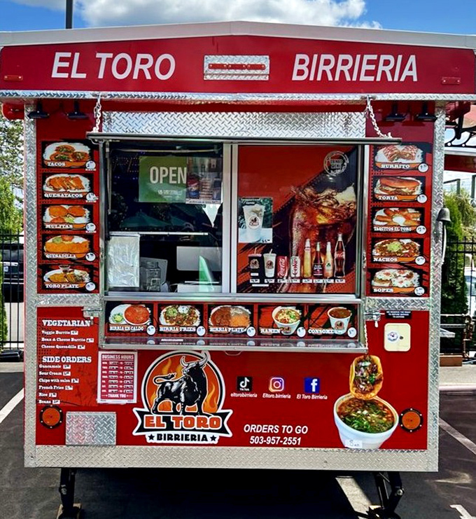 El Toro Birrieria's vibrant red cart showcases Mexican specialties that would make even the giant fork's mouth water, if it had one.