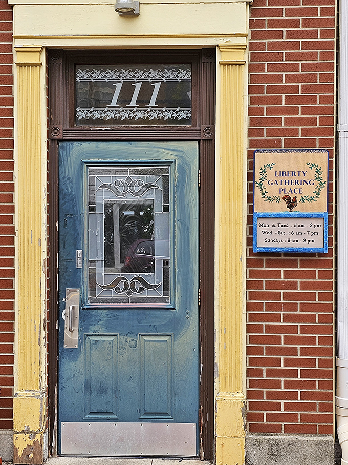 That blue door with its etched glass and the address "111" isn't just an entrance&mdash;it's a portal to the heart of West Liberty.