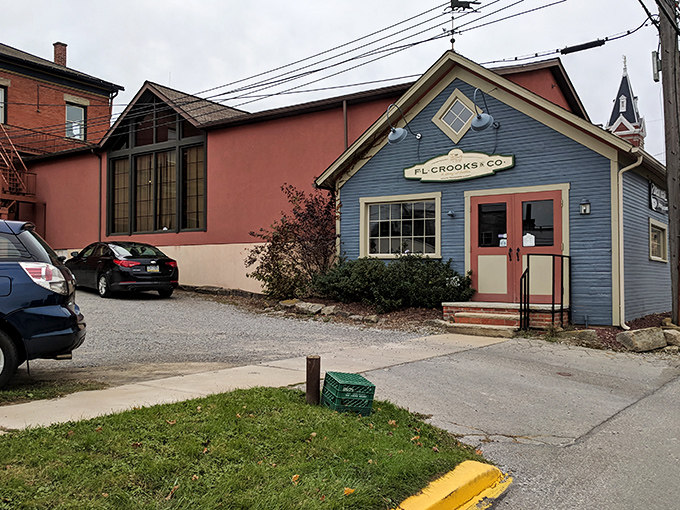 F.L. Crooks & Co.'s charming blue facade stands out like that one friend who refuses to follow trends but somehow always looks perfect.