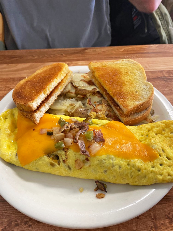 An omelet that's practically bursting with fillings and melted cheese. Breakfast shouldn't be shy about its intentions.