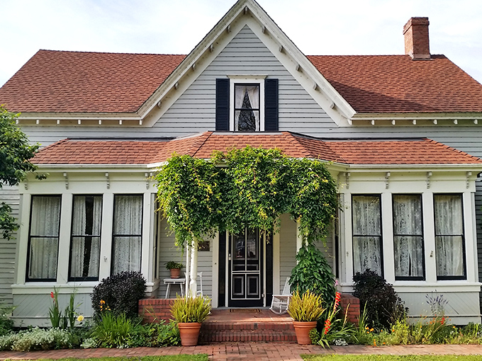 This picture-perfect Victorian cottage, wrapped in climbing vines, looks like it's waiting for a children's book illustrator to immortalize it.