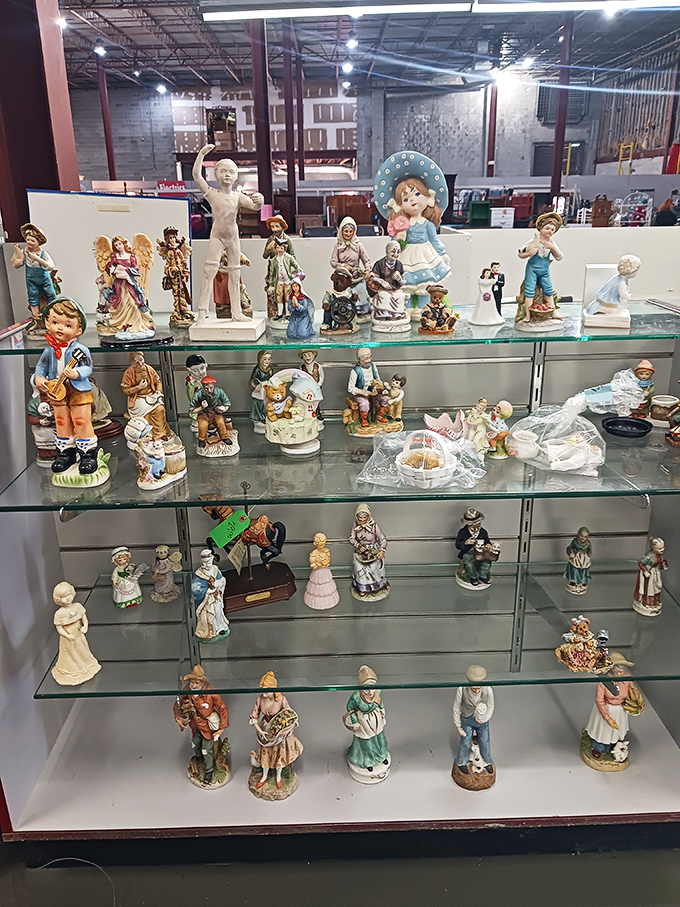 Figurine fantasyland! These porcelain personalities have survived decades to find themselves displayed together like the world's quirkiest family reunion.