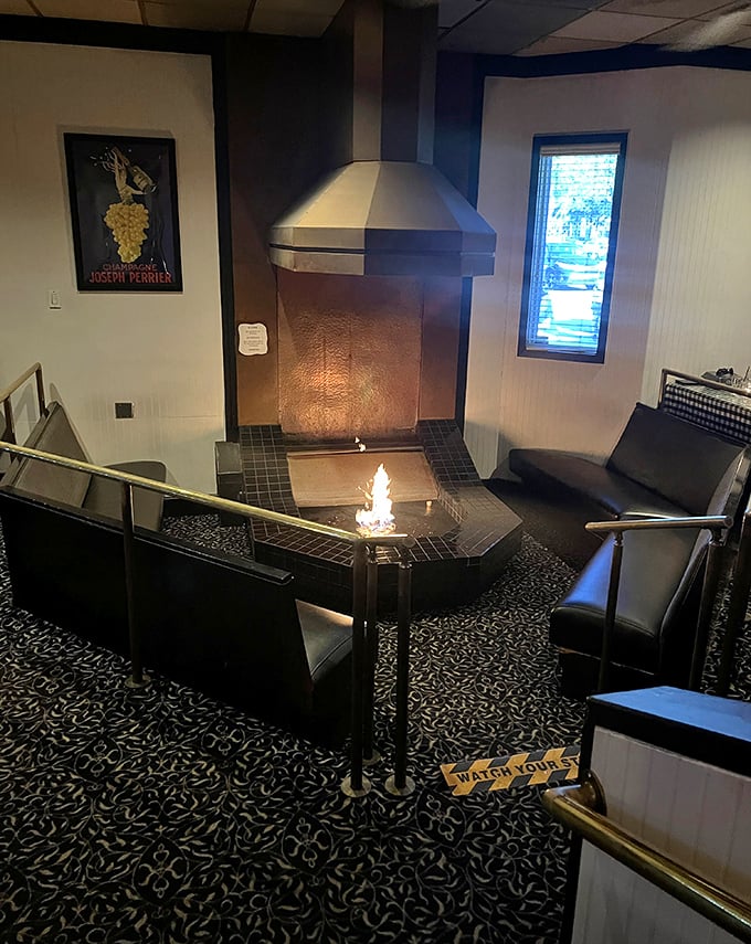 The indoor fire feature creates a mesmerizing focal point where diners can contemplate life's big questions &ndash; like whether to order another cocktail.