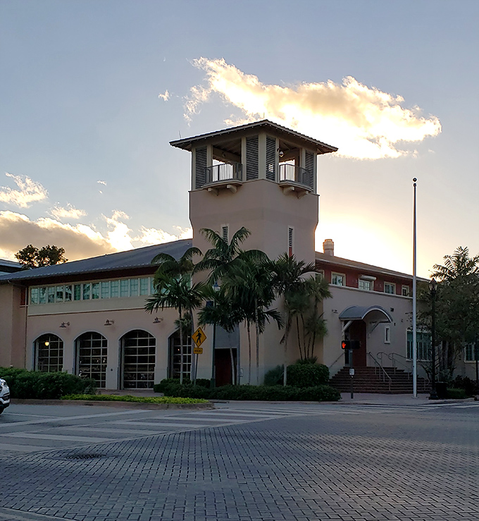 The community center's tower catches the day's last light, standing sentinel over a village that perfected the art of island living.