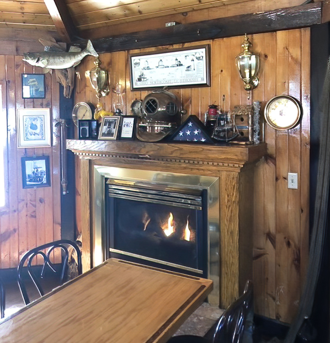 The fireplace corner offers the coziest spot in the house. That mounted fish above seems to say, "You made the right choice coming here."