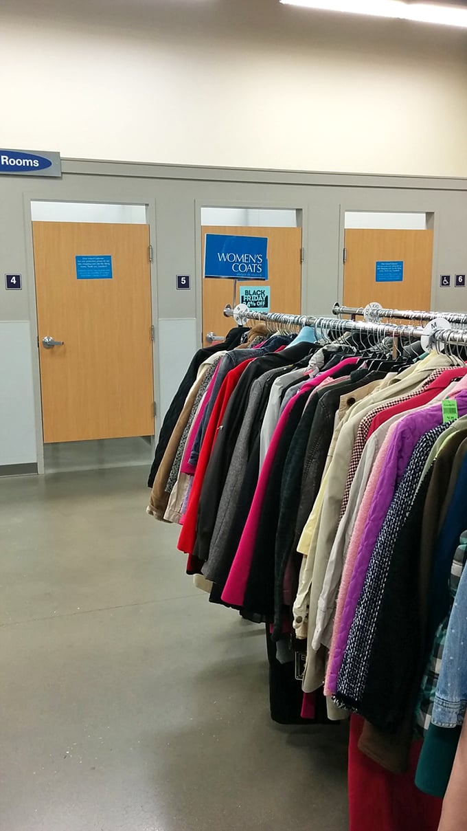The fitting room runway awaits! Winter coats line up like hopeful contestants on a reality show: "Pick me! I'll keep you warm!"
