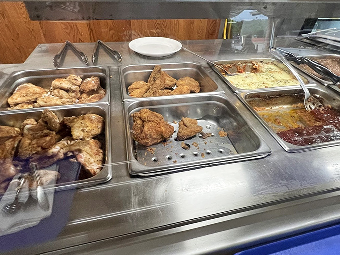The hot food station, where fried chicken waits patiently to fulfill its destiny as the highlight of your week.