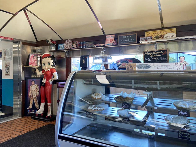 The dessert case &ndash; where willpower goes to die a delicious death. Each pie is practically winking at you, daring you to say "just coffee."