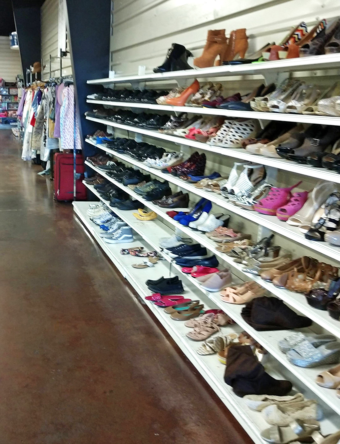 Shoes lined up like soldiers awaiting deployment to new feet, each pair carrying stories from dance floors past.