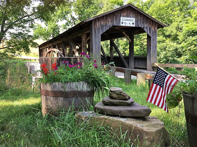 Wildflowers and an American flag create a quintessentially Pennsylvania welcome committee for this wooden sentinel.