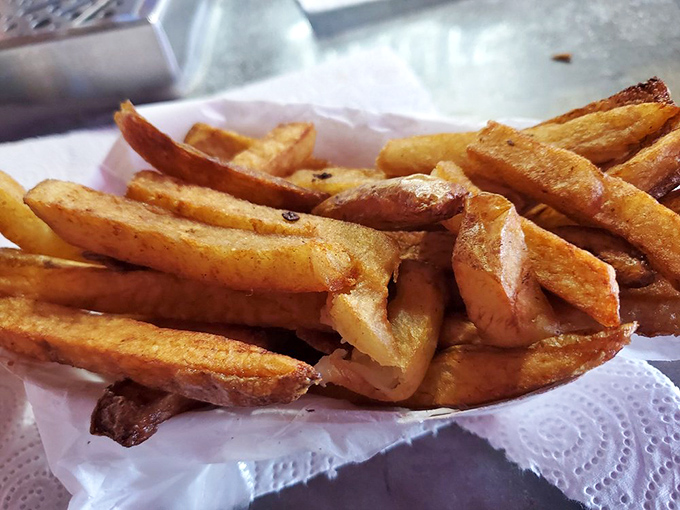 French fries with that golden-brown promise&mdash;crispy exteriors hiding fluffy potato interiors, like edible Texas treasure chests.