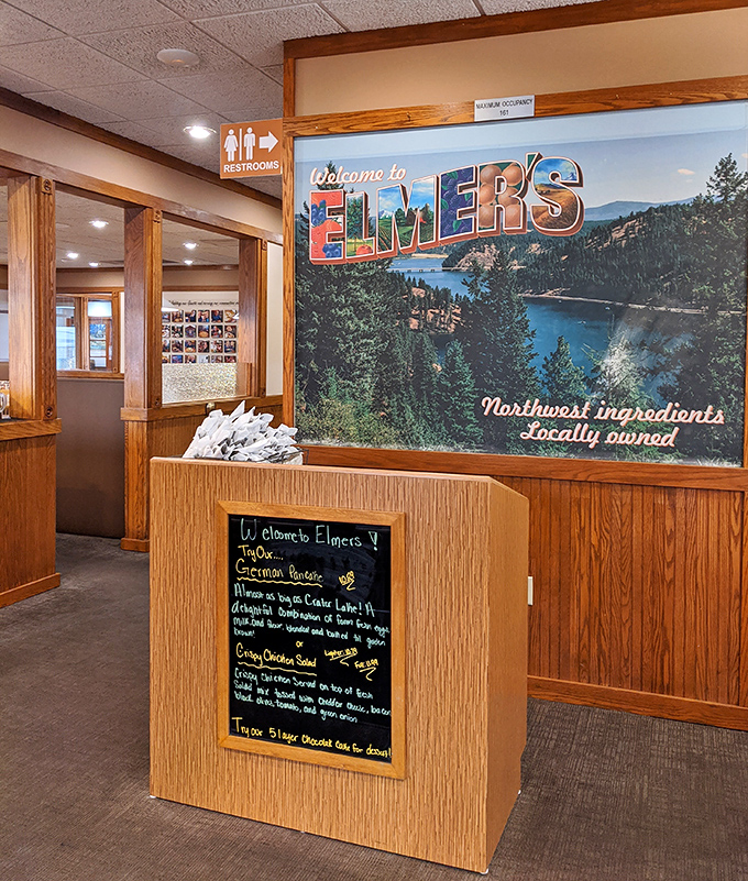 A welcome sign featuring Lake Coeur d'Alene reminds you that great views outside deserve equally impressive flavors inside.