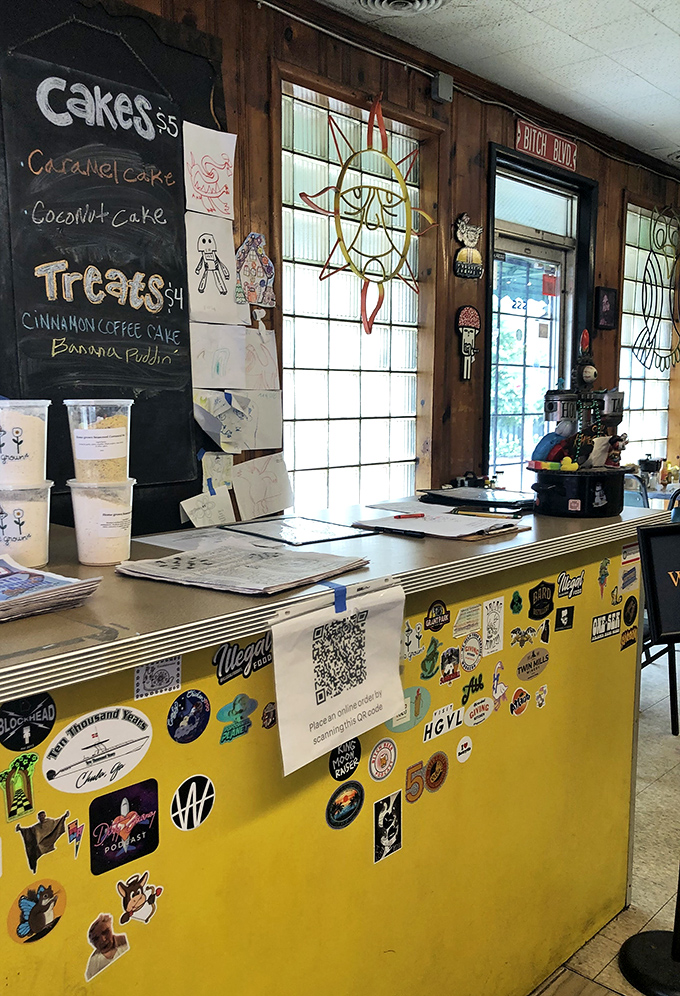 A chalkboard menu of homemade desserts and a counter plastered with stickers&mdash;visual proof you're in a place with personality to spare.