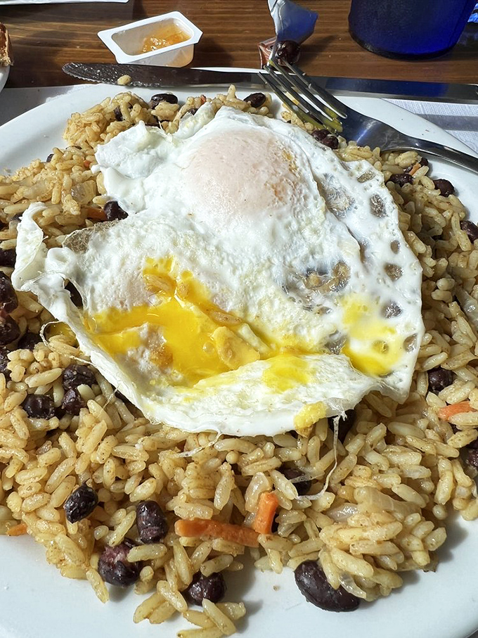 Rice and beans topped with a perfectly fried egg&mdash;sunshine breaking through morning clouds on your plate.