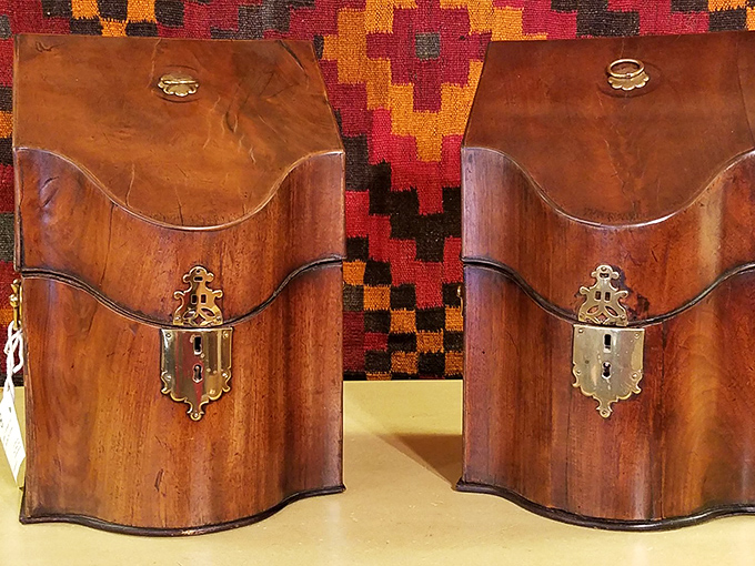 Twin knife boxes standing at attention like loyal butlers. These Georgian-style beauties have probably witnessed more fancy dinner parties than a Downtown Abbey episode.