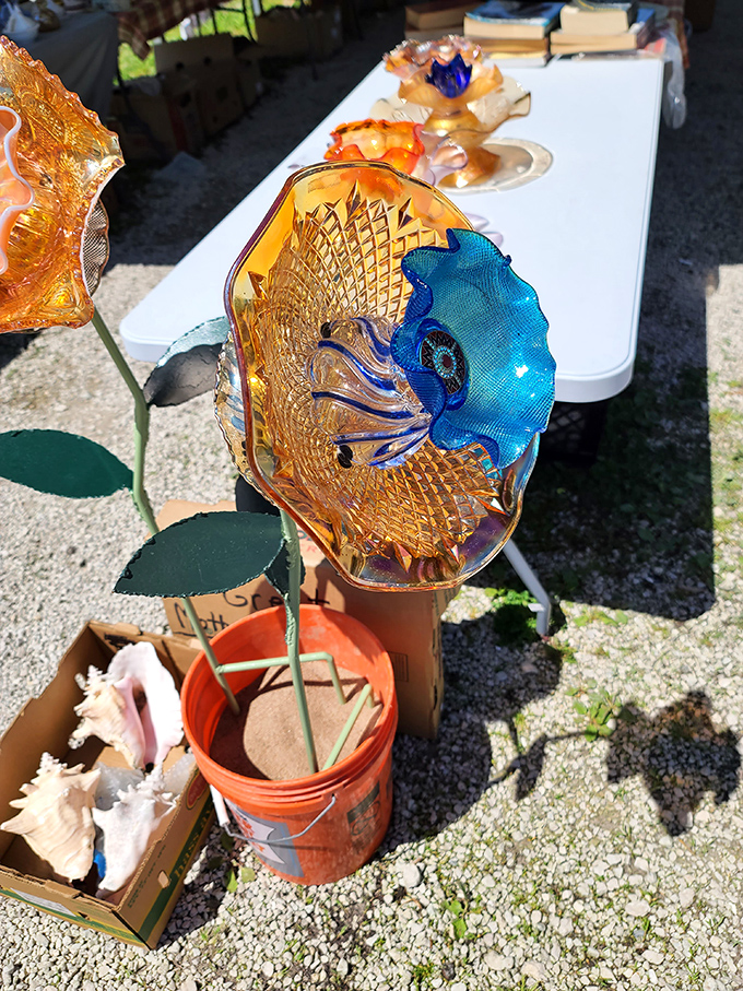 Colorful glass art transforms everyday garden d&eacute;cor into something that catches sunlight like a kaleidoscope came to life.