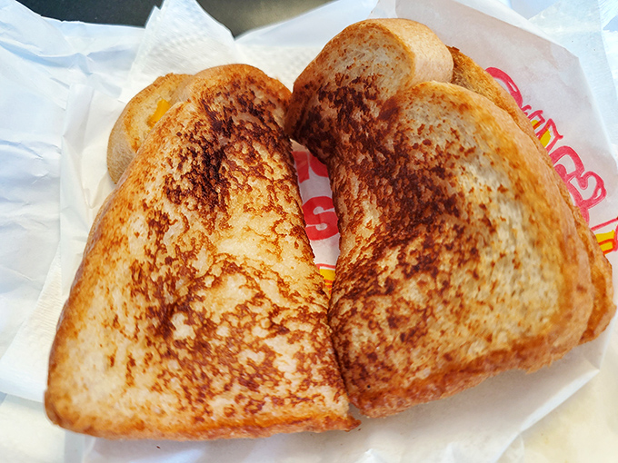 Grilled cheese perfection isn't complicated: golden-brown bread with the ideal toast marks, encasing melted cheese in its warm, buttery embrace.