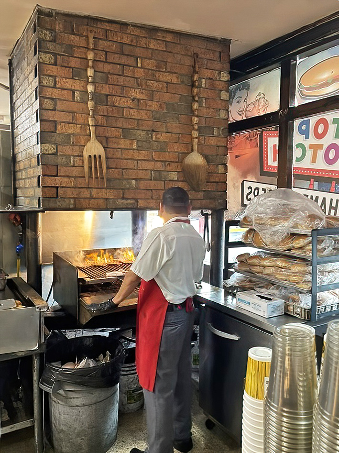 Watch your burger get grilled over real flames, because some cooking methods are simply superior to all others, period.