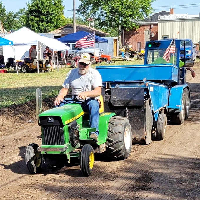 Nothing says "heartland heritage" quite like a John Deere tractor pulling a homemade wagon through a community festival.
