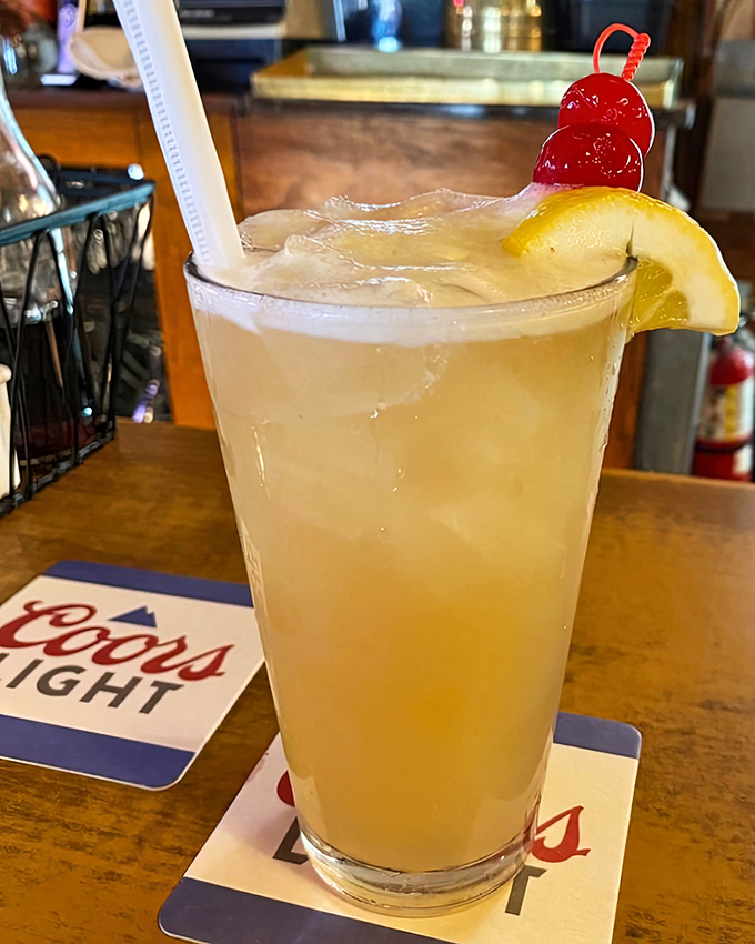 This refreshing cocktail with its cherry garnish and lemon slice isn't just a drink&mdash;it's liquid vacation in a glass.