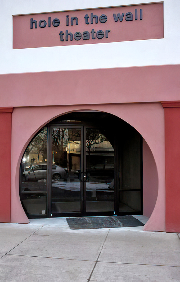 The Hole in the Wall Theater's distinctive entrance promises performances as unique as its architecture. Small venue, big personality.