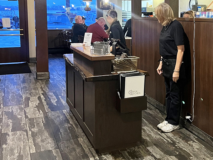 The host station&mdash;that magical threshold where hungry strangers enter and satisfied regulars exit, with staff orchestrating the delicious transformation.