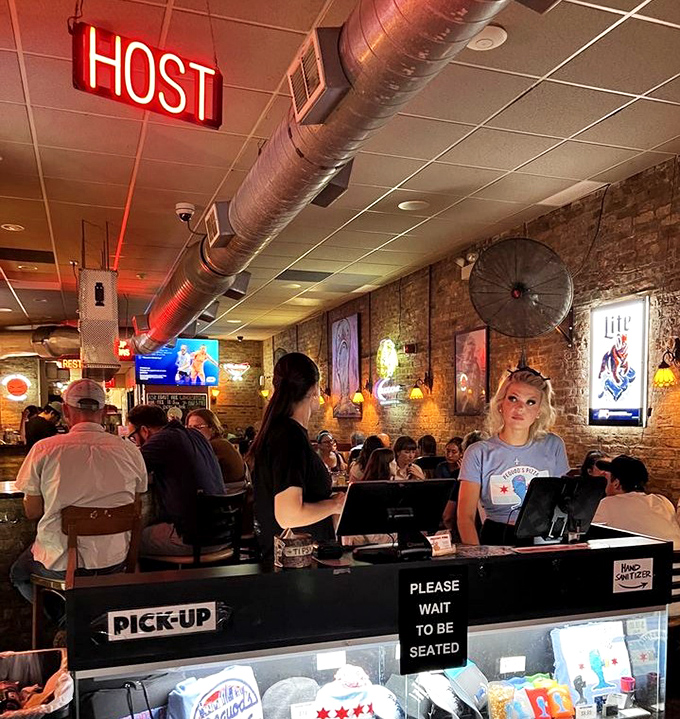 The host station: gateway to pizza nirvana. That "Please Wait to be Seated" sign might as well read "Patience Will Be Rewarded."