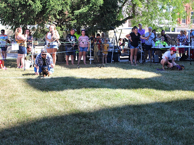 The Hot Dog Festival brings the community together for some good old-fashioned fun. Notice how nobody's checking their phones&mdash;they're too busy enjoying actual human connection.