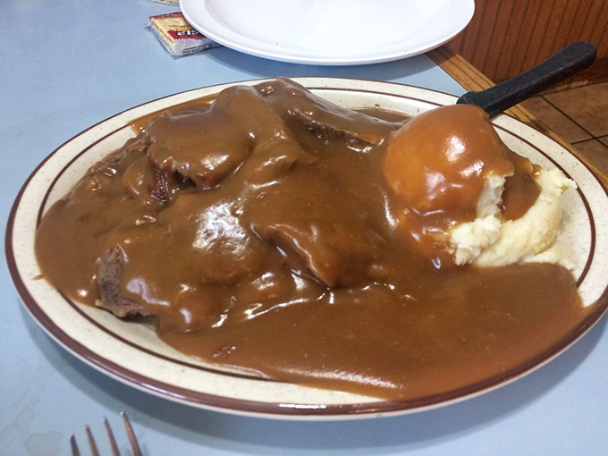 The hot beef sandwich swimming in gravy &ndash; comfort food so sincere it could make a therapist obsolete.