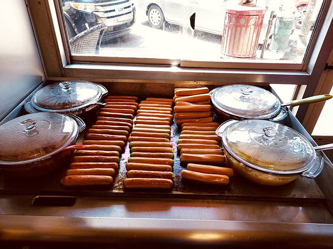Hot dog heaven in progress. Like watching an artist at work, except the canvas is your lunch.
