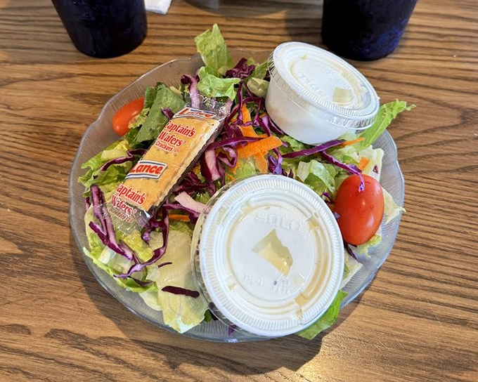 A house salad that actually deserves attention. Fresh, colorful, and the perfect counterpoint to all that glorious fried goodness.