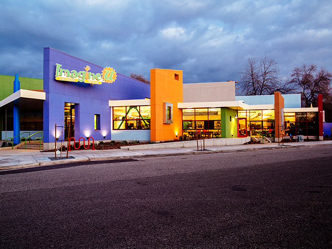 ImagineU Children's Museum's colorful facade glows at dusk, promising educational adventures that kids won't realize are educational until it's too late. 