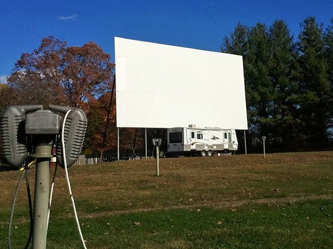 Vintage speaker stands remain as charming relics of a bygone era. Today's visitors tune their FM radios, but these sentinels stand guard over drive-in history.