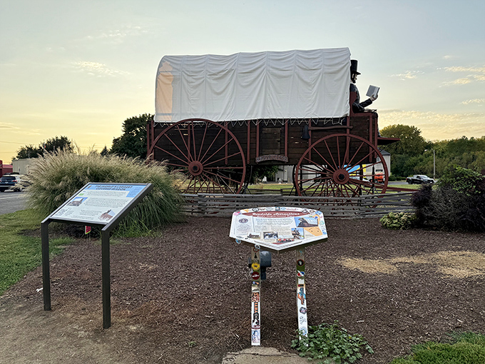The informational display offers context, but let's be honest&mdash;you're here because you spotted a giant Lincoln reading atop a massive wagon from the highway.